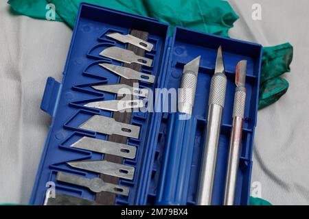 A box with surgical instruments over dirty bloody plastic gloves Stock ...