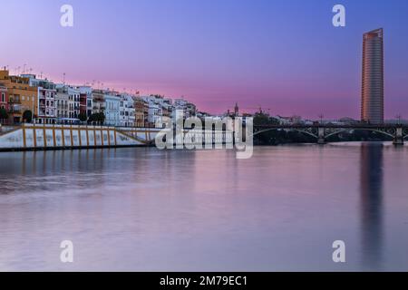 Sunset over the authentic neighborhood of Tirana in Seville with views on Calle Betis, Torre ...