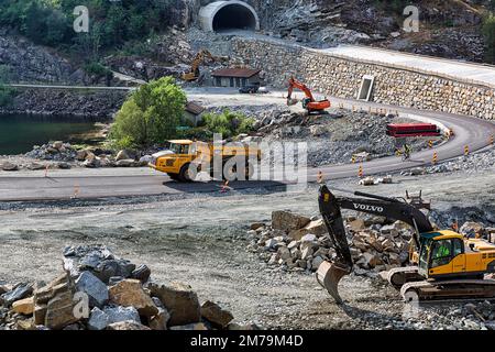 Construction site vehicles on a new build building site. Rear view of a ...