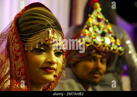 Karachi. 8th Jan, 2023. A bride poses for a photo during a mass wedding ...