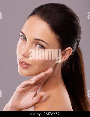 Silky smooth skin. an attractive young woman isolated on white Stock ...