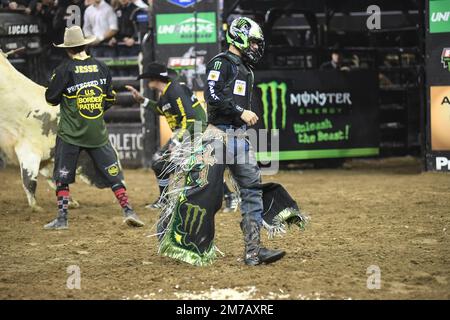 Professional Bull Rider Jose Vitor Leme is presented a trophy after ...