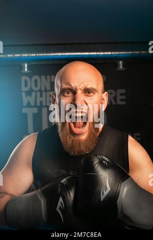 Bald male fighter Stock Photo - Alamy