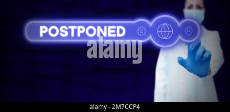 Sign displaying Postponed. Word Written on to place later in order of ...