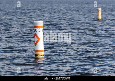 Hazard safety buoy alerting boaters to navigation danger. Nautical ...