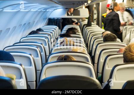 Seat backs and rows of passenger seats / seating on a BA Airbus A321 ...