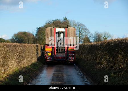 A large lorry blocks a narrow country lane in the cotswolds ...