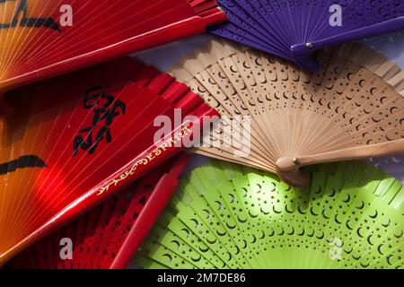 Multicoloured traditional spanish fans spread out for sale as ...