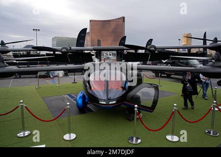 People view a functional prototype of the ASKA A5 VTOL flying car during the CES tech show ...