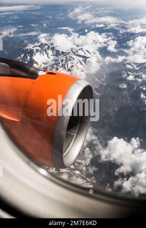Thin wispy cloud covers The Alps mountin range as seen from an ...
