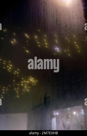 An exterior view of a window with fairy lights Stock Photo - Alamy