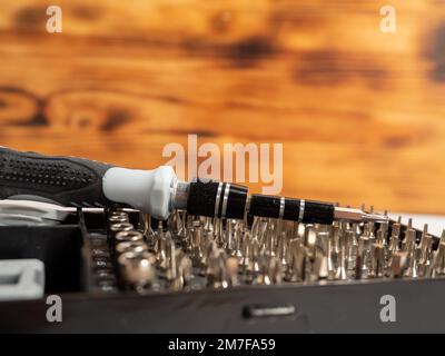 Universal set of screwdriver bits with different bits. Close-up bit set ...
