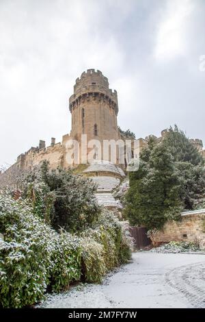 Warwick castle after a light winter snowfall seen from Mill Street ...