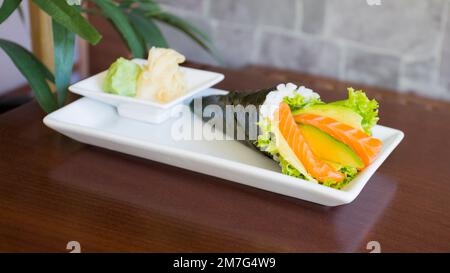 Salmon temaki. Temakis are cone-shaped pieces of sushi made of nori ...