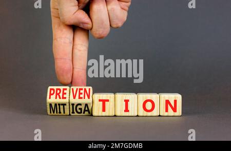Prevention or mitigation symbol. Businessman turns cubes and changes ...