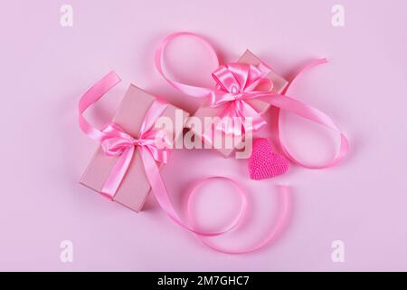 Valentines day card with gift boxes and rose flower petals. On red ...