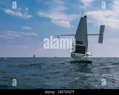 A U.S. Navy Saildrone Explorer unmanned surface vessel remotely sails ...
