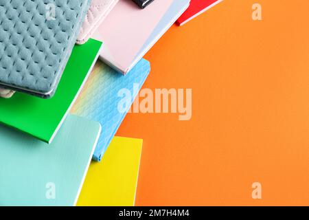 Stack of different notebooks on color background, closeup Stock Photo ...