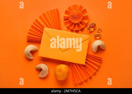 Envelope with fortune cookies, mandarin and Chinese symbols on pink ...