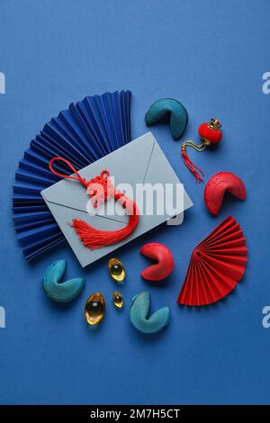 Fortune cookies with envelope and Chinese symbols on blue background ...