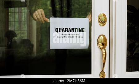 Coronavirus pandemic notice. Man hangs Covid-19 virus self quarantine ...