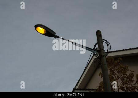the residential lamp post illuminating the street Stock Photo - Alamy