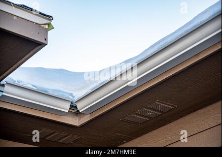 Metal gutters be installed on a residential buildings with two sections ...