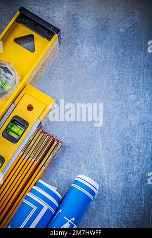 Blue engineering drawings construction levels square ruler on metallic ...