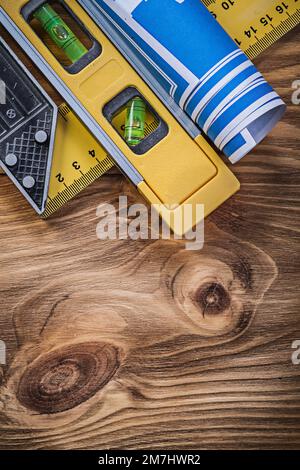 Construction level try square rolled blueprint wooden meter and claw ...