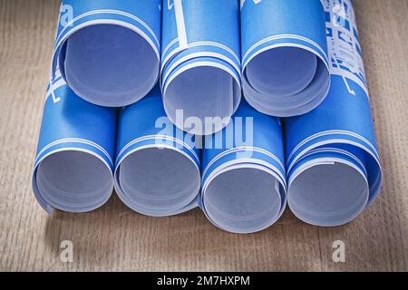 Composition of blue construction drawings wooden meter on metallic ...