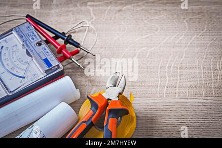 Electrical tester blueprints insulation tape nippers Stock Photo - Alamy