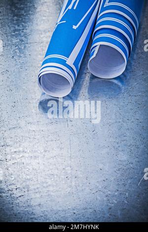 Blue engineering drawings on metallic background construction concept ...