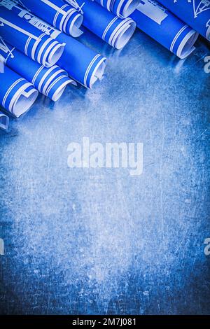 Blue engineering drawings on metallic background construction concept ...