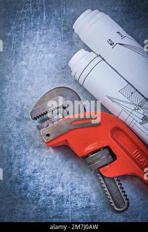 Pipe adjustable wrench construction plans on metallic background ...