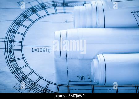 Rolled engineering drawings on blueprint Stock Photo - Alamy
