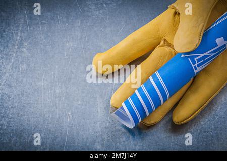 Safety gloves blue engineering drawings on metallic background ...