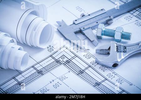 Construction plans vernier caliper adjustable wrench on grooved metal ...