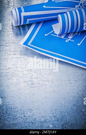 Blue engineering drawings on metallic background construction concept ...