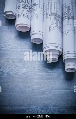 vertical view stack of rolled blueprints on board Stock Photo - Alamy
