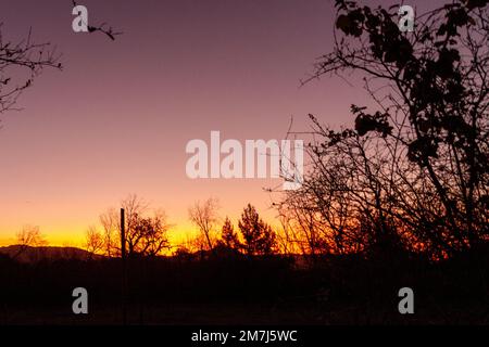 Landsacpe close to Tulbagh during sunset with orange sky and ...