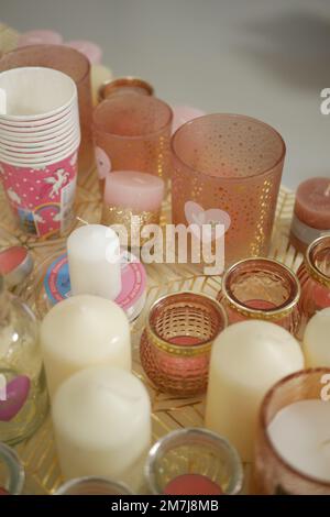 A table with lots of candles and glass vases Stock Photo - Alamy