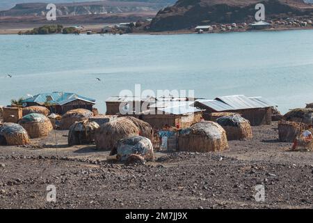 Traditional houses of the El Molo people in El Molo village living at ...