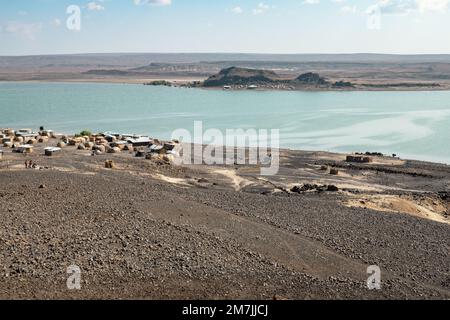 Traditional houses of the El Molo people in El Molo village living at ...