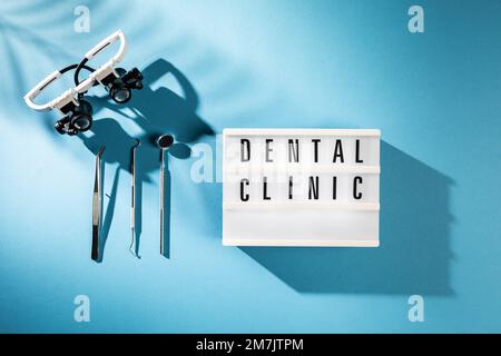 Dental Clinic sign on Blue Background Stock Photo - Alamy