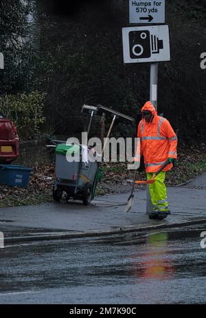 Road Sweeper clearing the pavements in the rain in winter in South ...