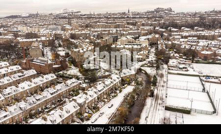 Aerial views of a snowfell Edinburgh. The city is under a yellow met ...