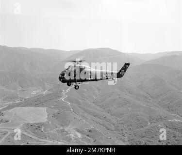 A left side view of a Marine UH-1N Iroquois (Huey) helicopter sitting ...