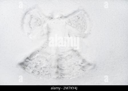 Snow angel made in the white snow Stock Photo - Alamy