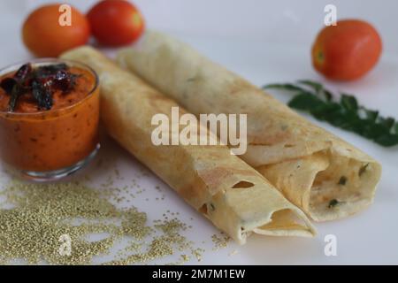 Thin crispy Indian crepe made of brown top millet and lentils. A ...