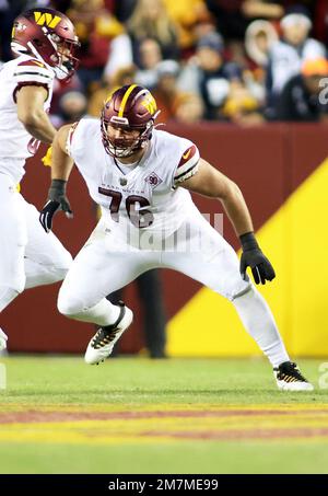 Washington Commanders offensive tackle Sam Cosmi (76) blocks during an ...